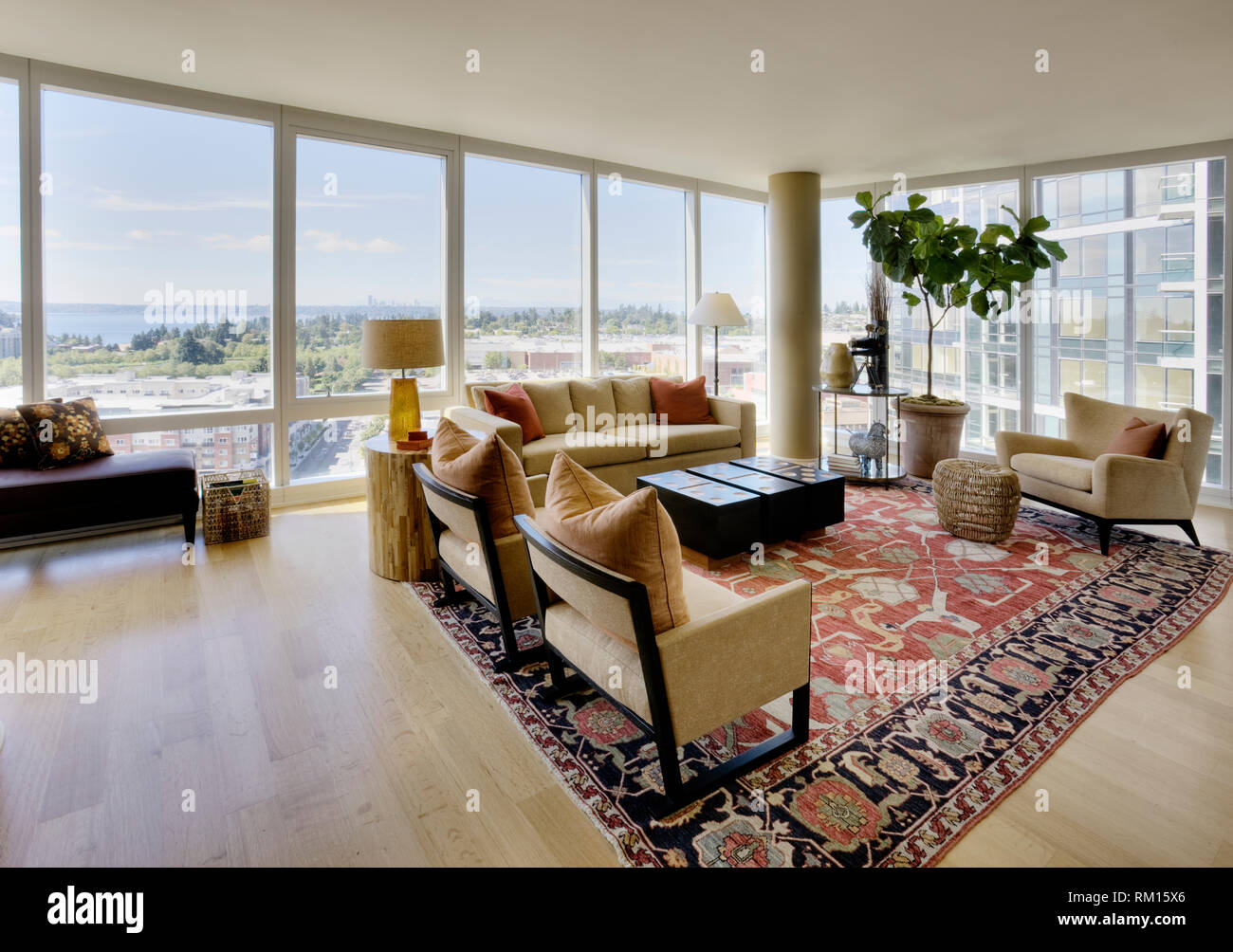 Living room in luxury highrise apartment Stock Photo - Alamy
