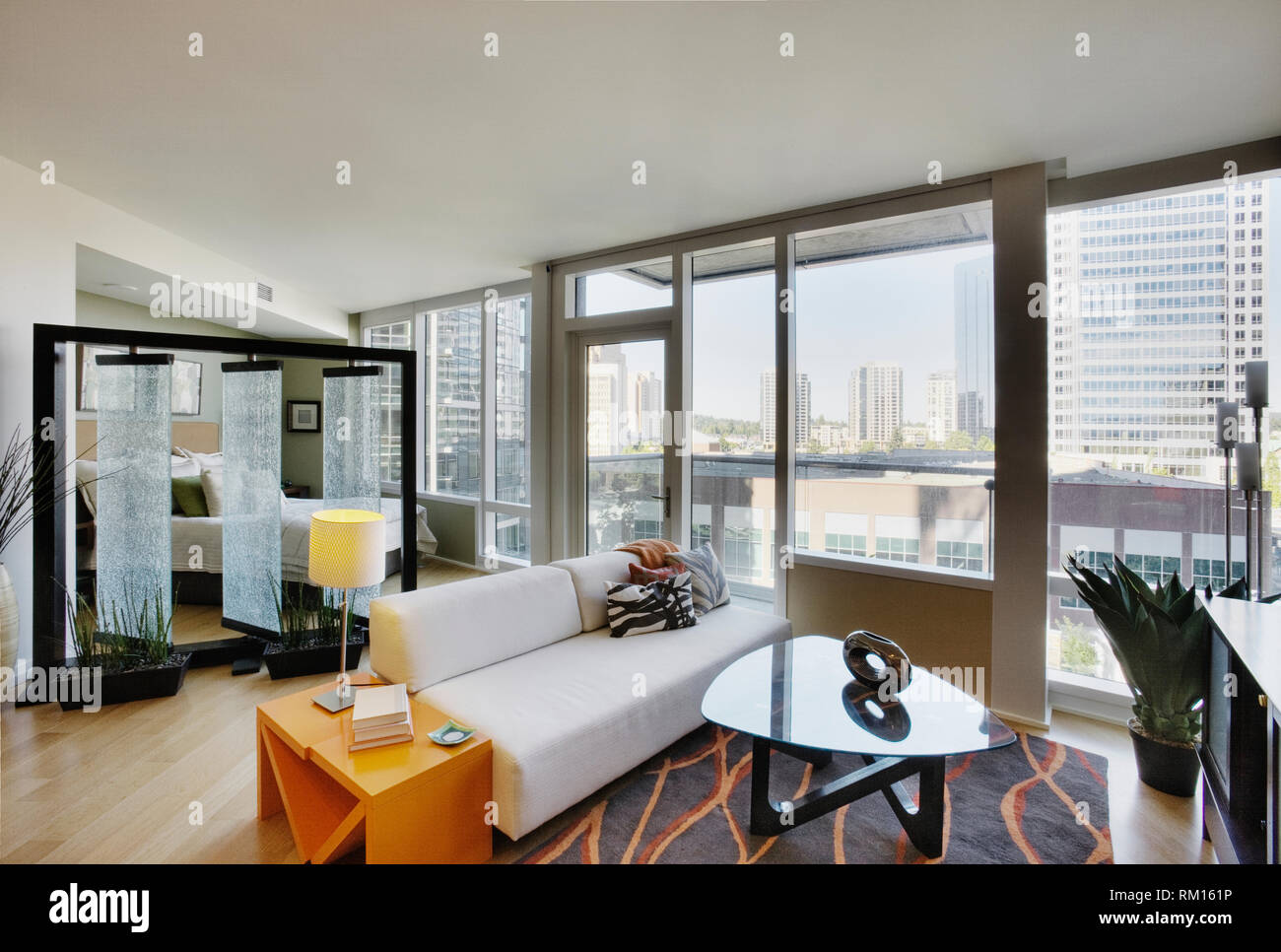 Living room in luxury highrise apartment Stock Photo - Alamy