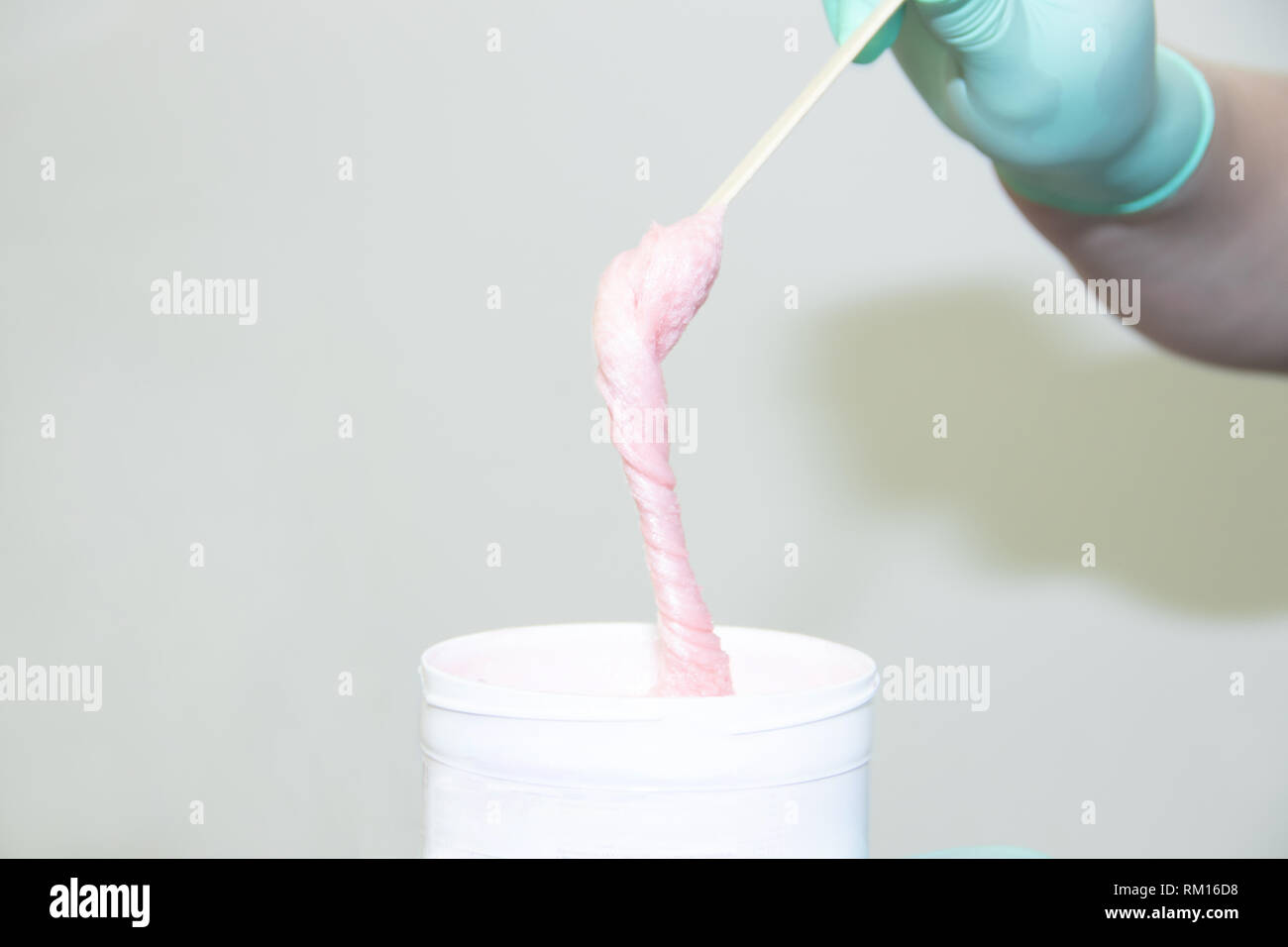 Sugar paste for depilation. Shugaring in the spa salon. Beauty and ...