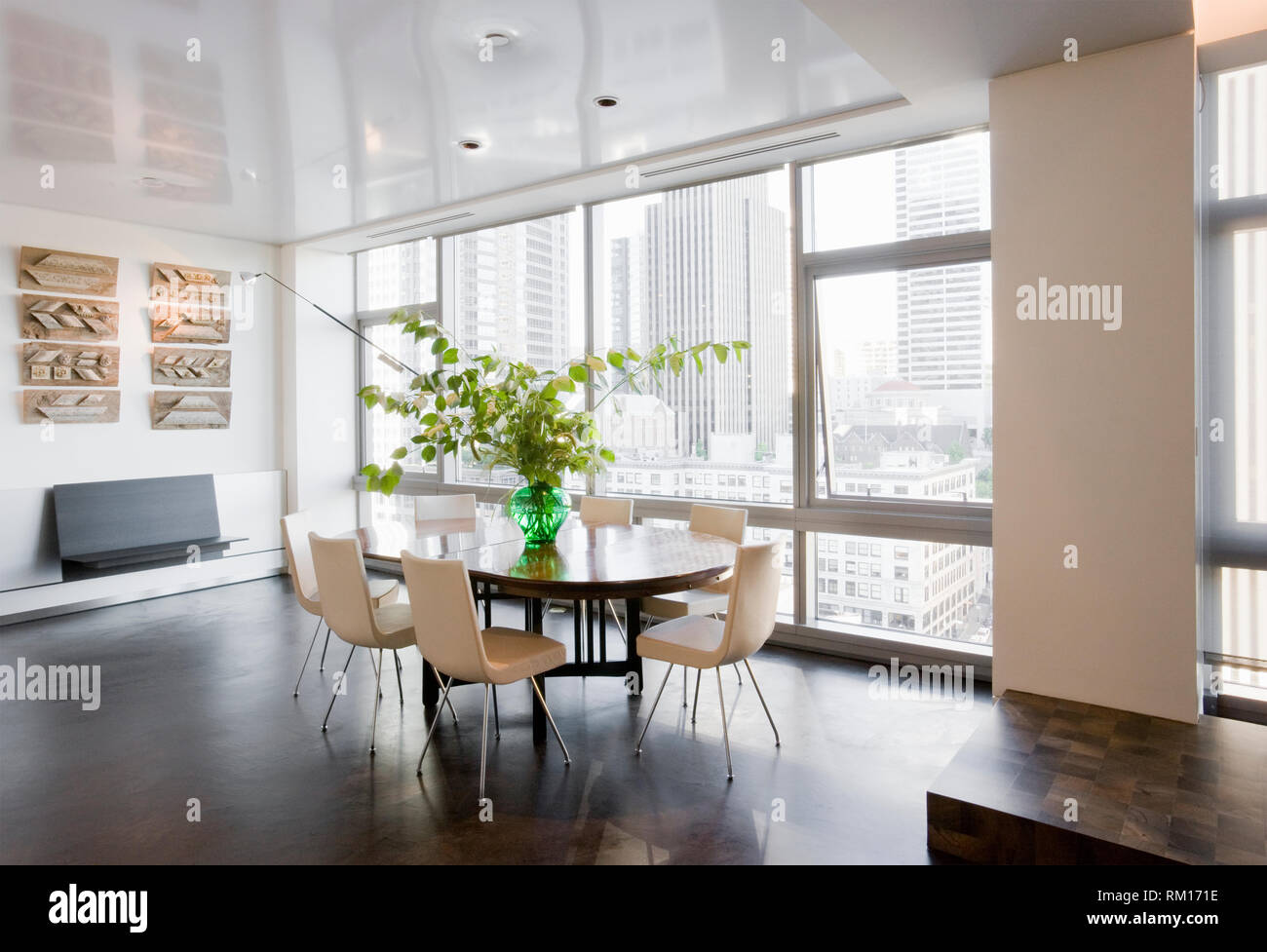 Dining room in luxury highrise apartment Stock Photo - Alamy