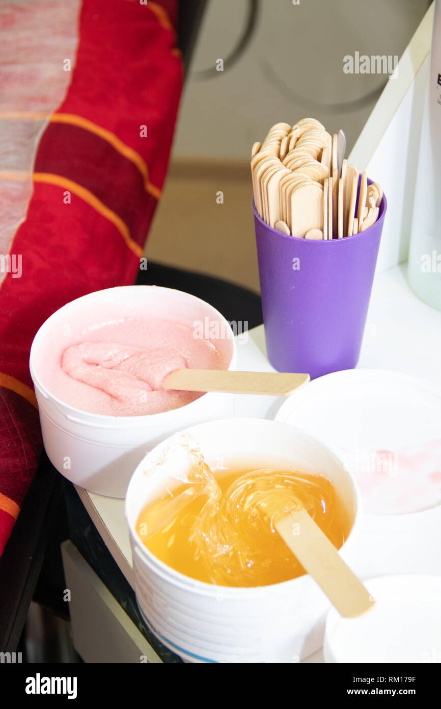 Sugar paste for depilation. Shugaring in the spa salon. Beauty and ...