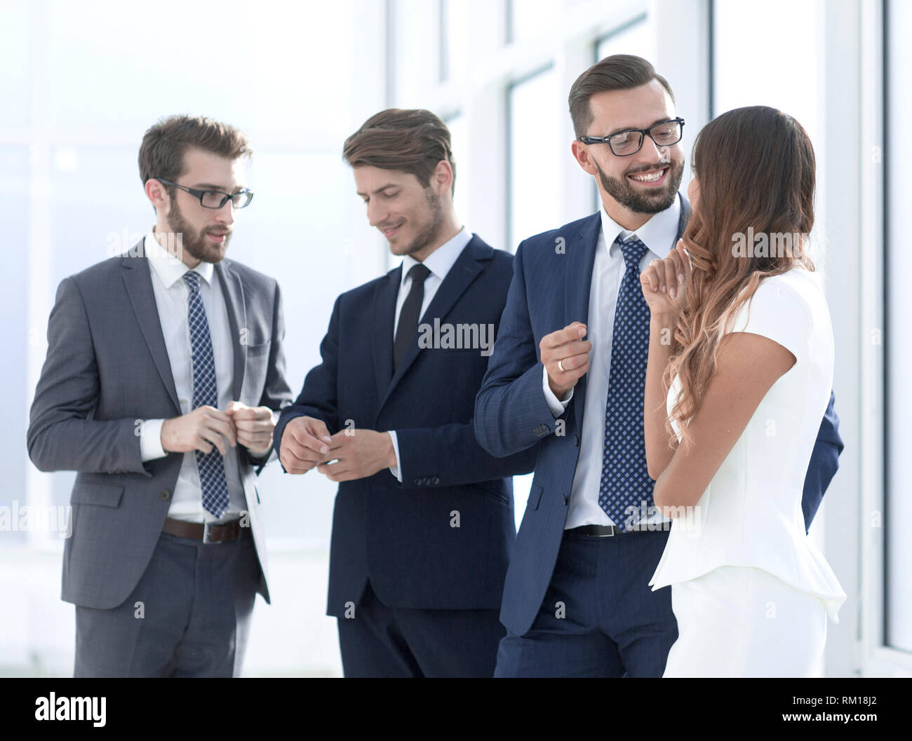 employees of the company standing in the office lobby Stock Photo - Alamy