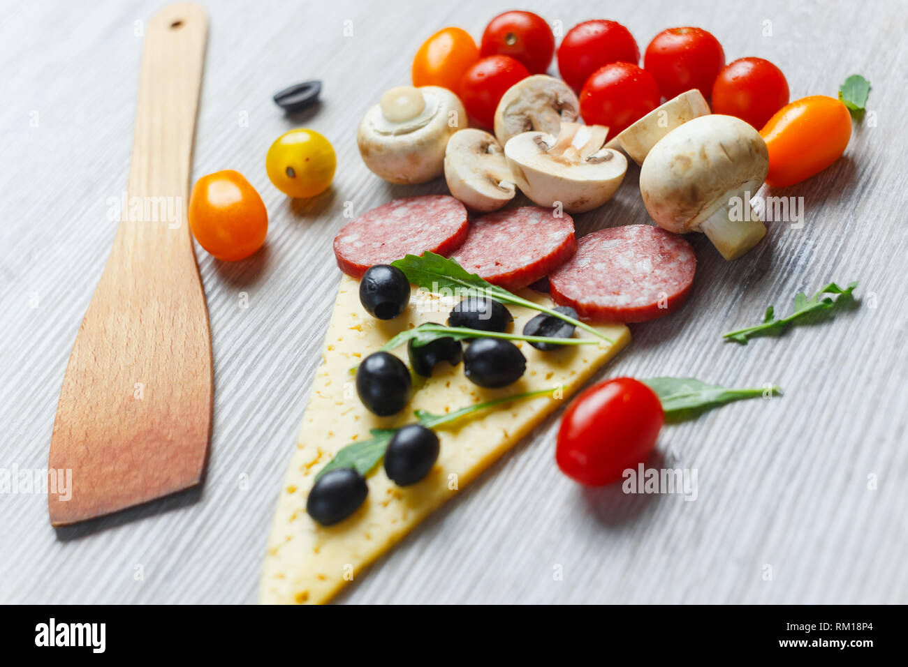 Creative composition of ingredients in the form of a slice of pizza ...
