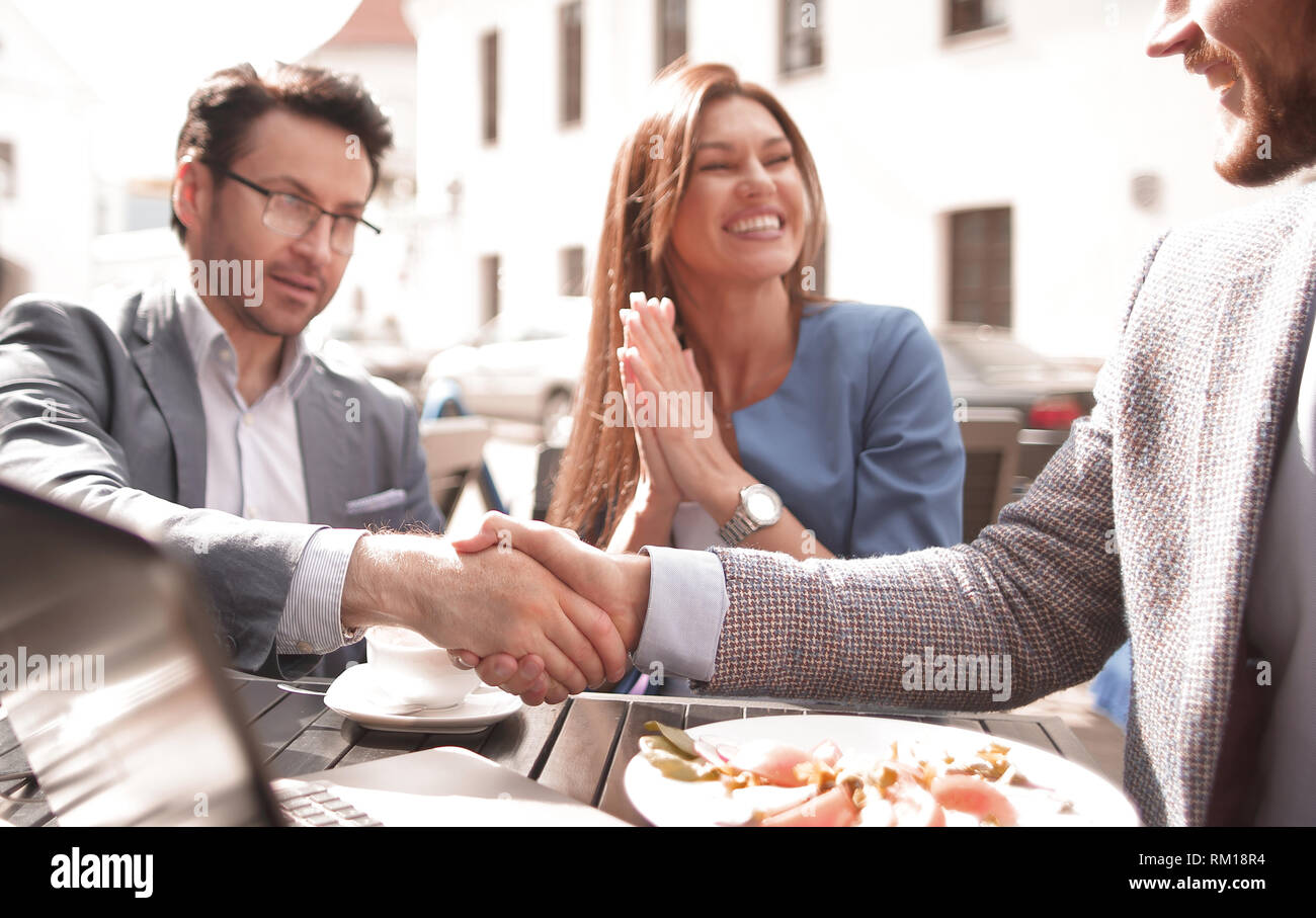 Women handshake restaurant hi-res stock photography and images - Alamy