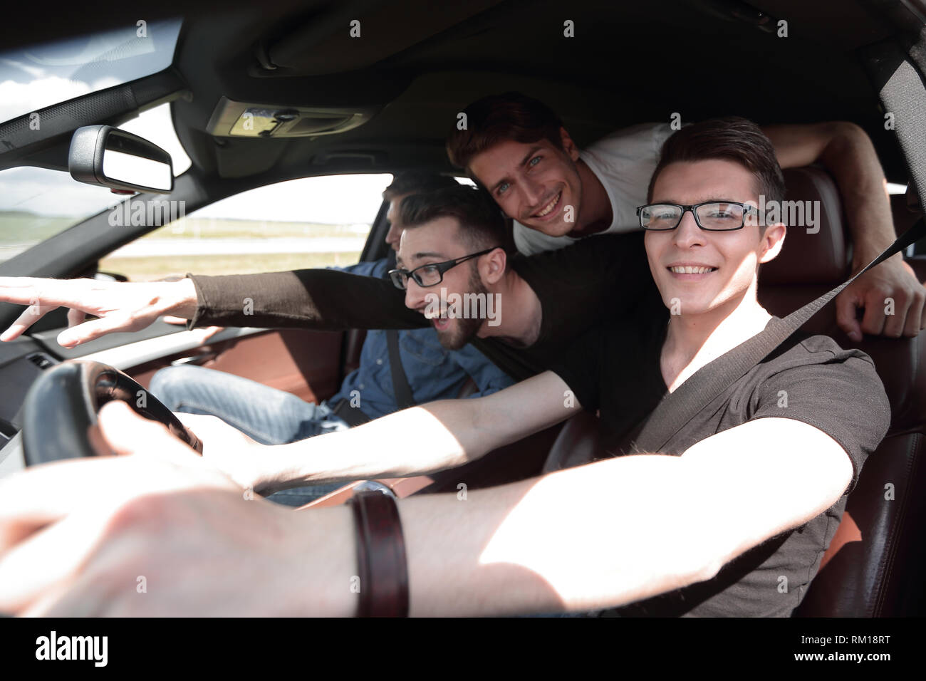 Group Of Friends In Car On Road Trip Together Stock Photo - Alamy