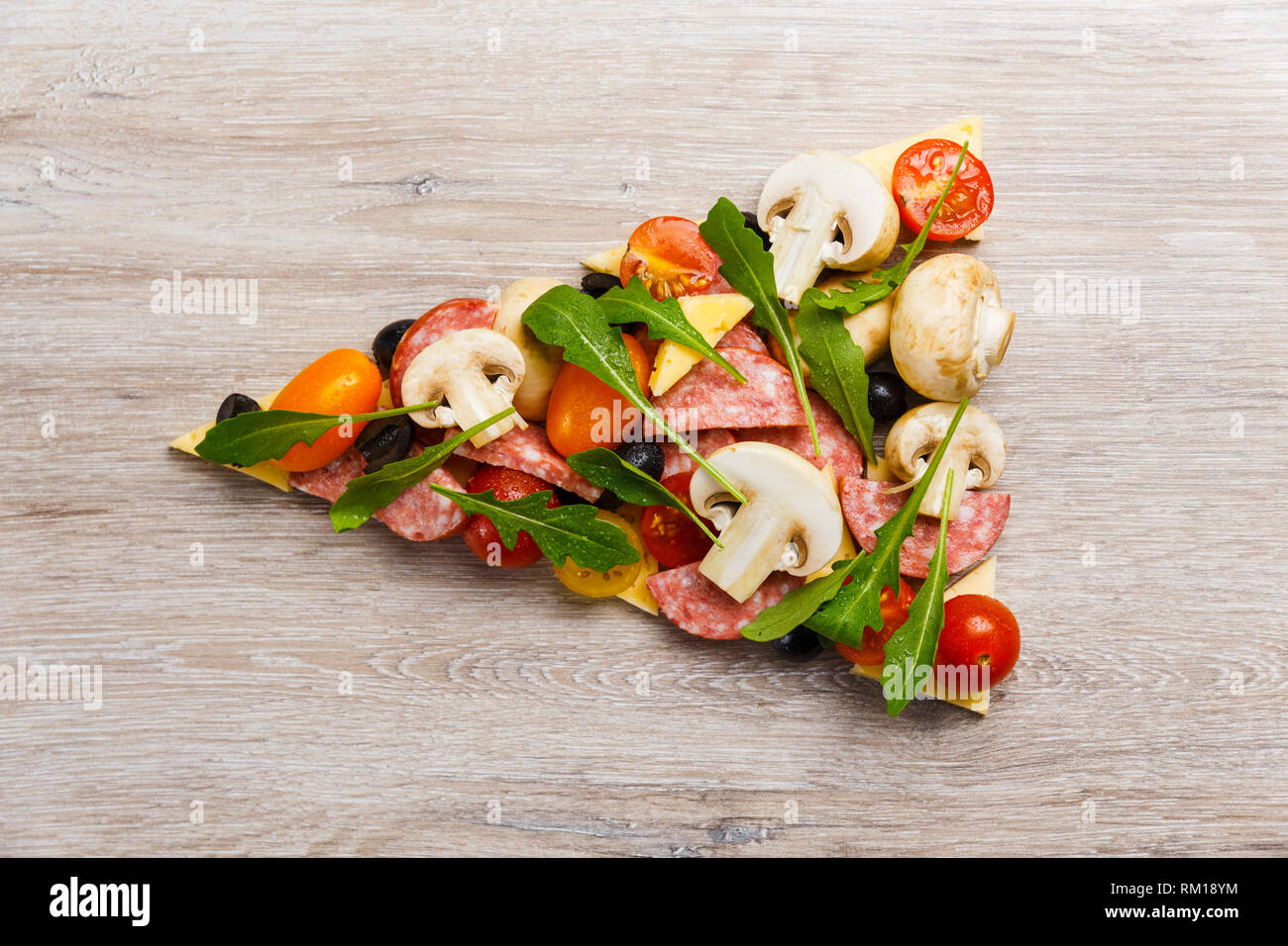 Creative composition of ingredients in the form of a slice of pizza ...