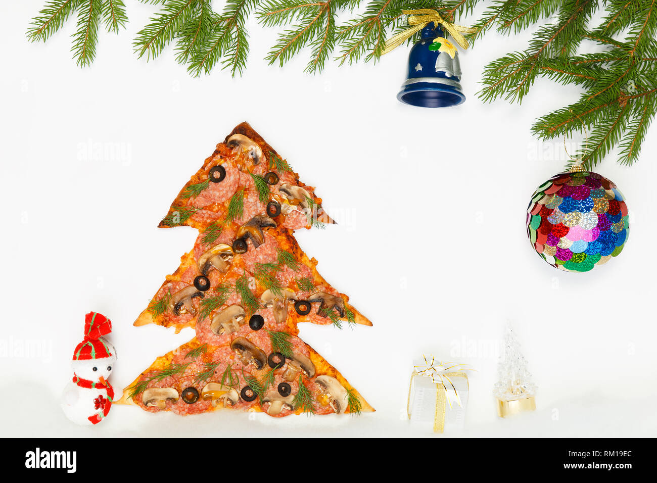 Greeting card with a pizza in the shape of a Christmas tree and gifts ...