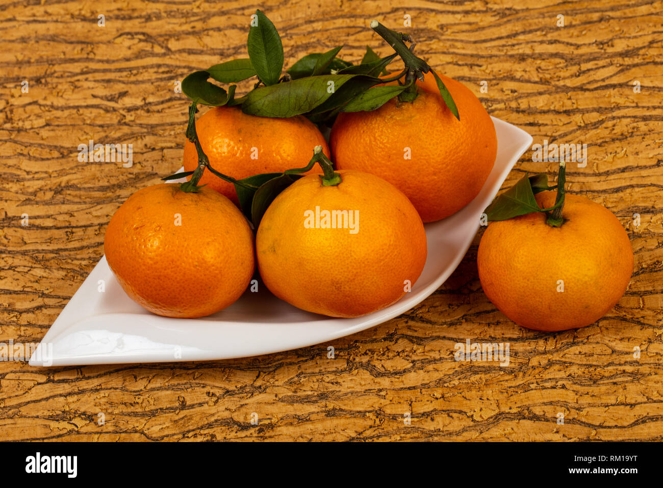 Sweet ripe Mandarin with green leaves Stock Photo - Alamy