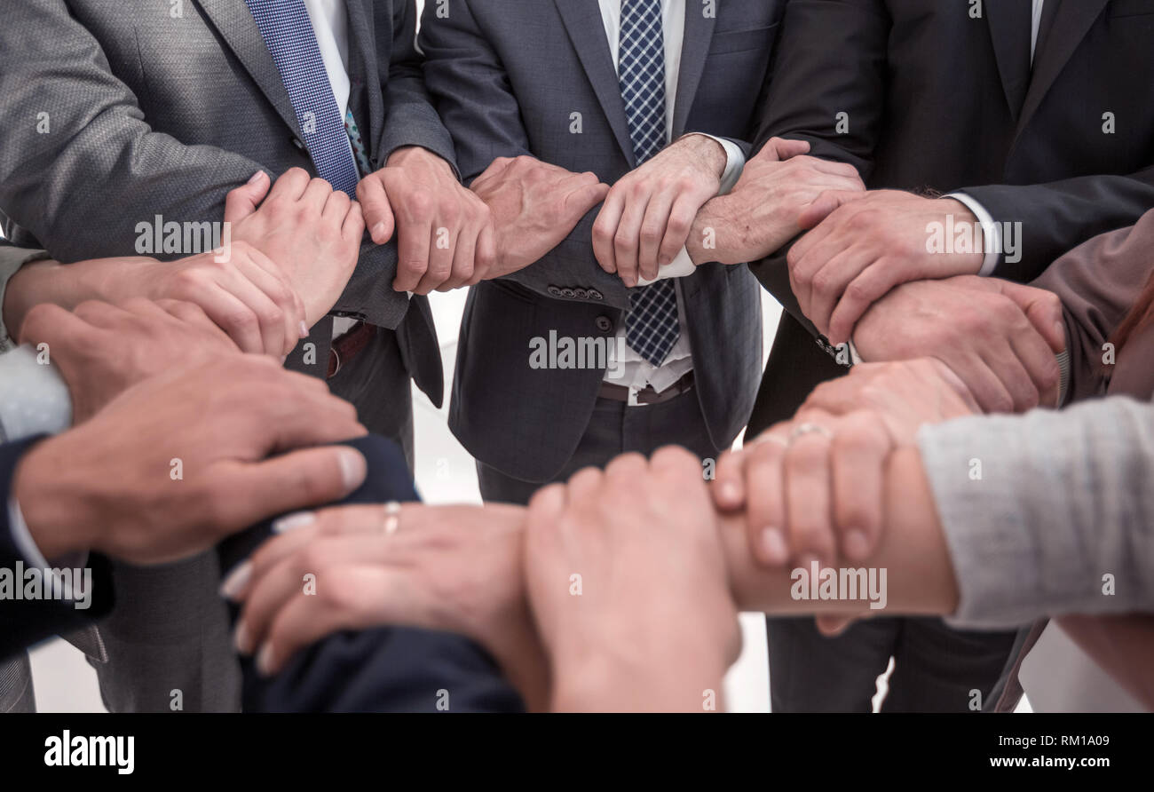 close up.business team showing their unity Stock Photo - Alamy