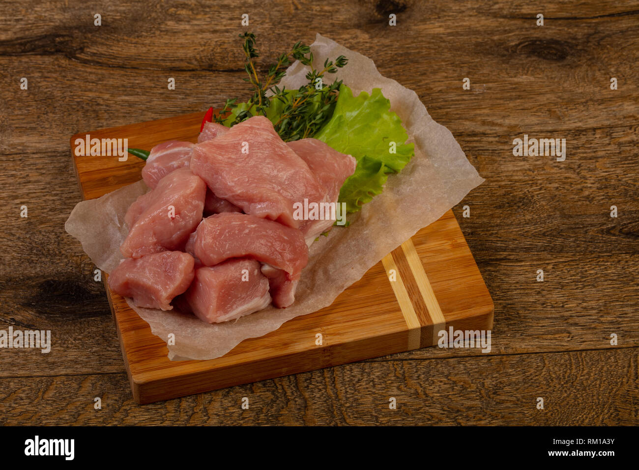 Raw pork meat heap for roast Stock Photo - Alamy