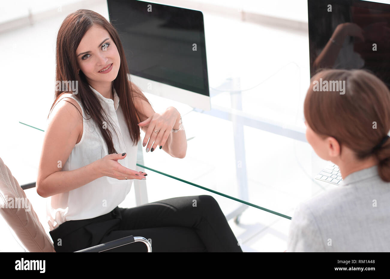 employees of the company discuss work issues at the desktop Stock Photo ...