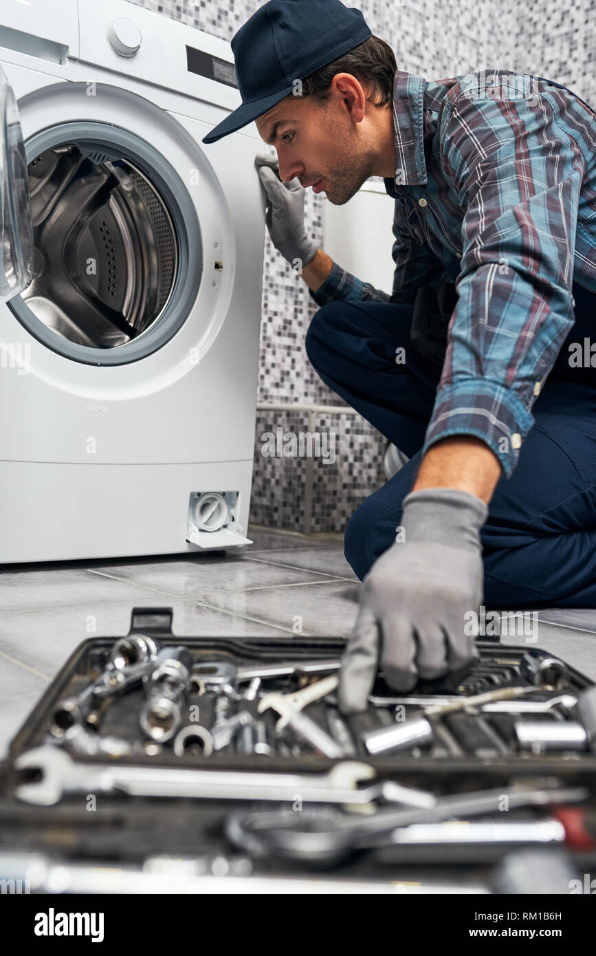 Professional mechanic choose instruments hi-res stock photography and ...