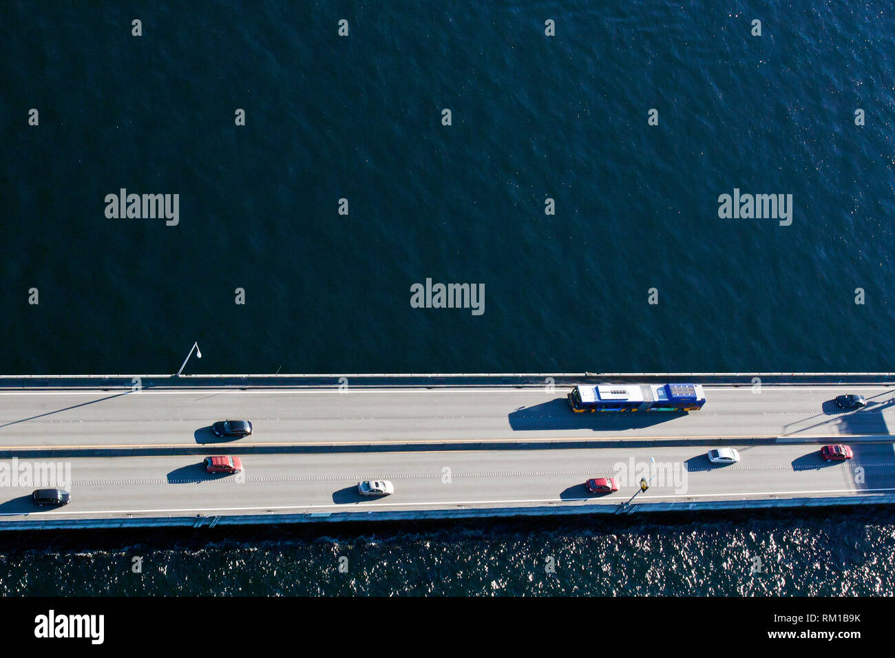 View of cars driving over floating bridge Stock Photo - Alamy