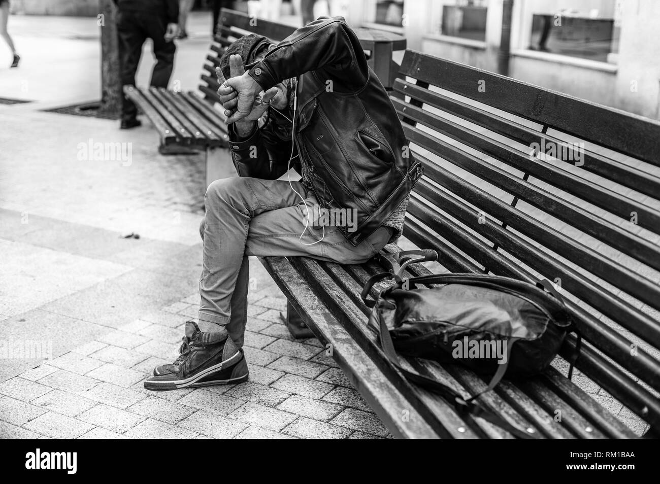 Man sitting on a bench Black and White Stock Photos & Images - Alamy