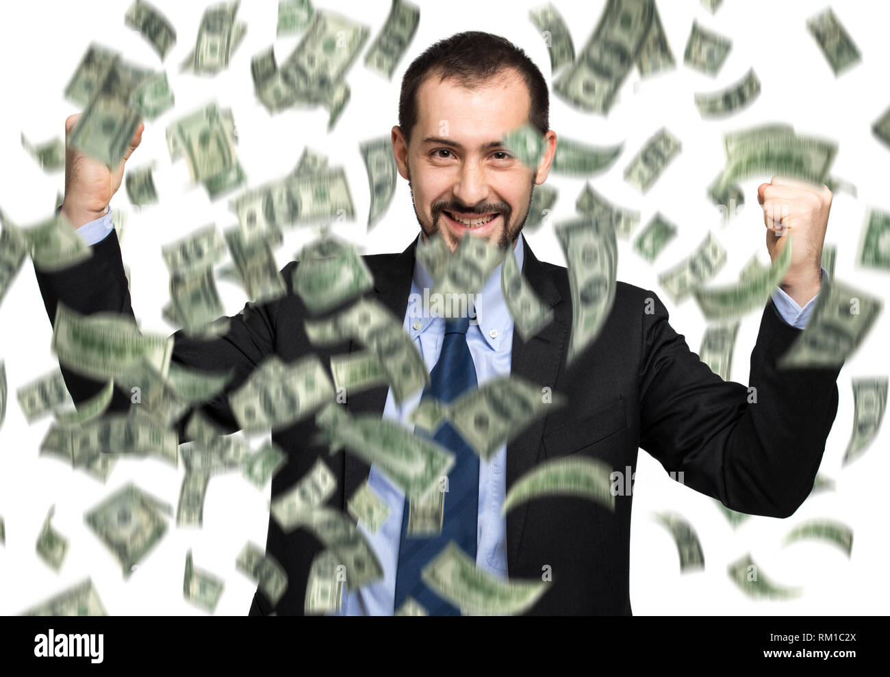 Happy man enjoying the rain of money Stock Photo - Alamy