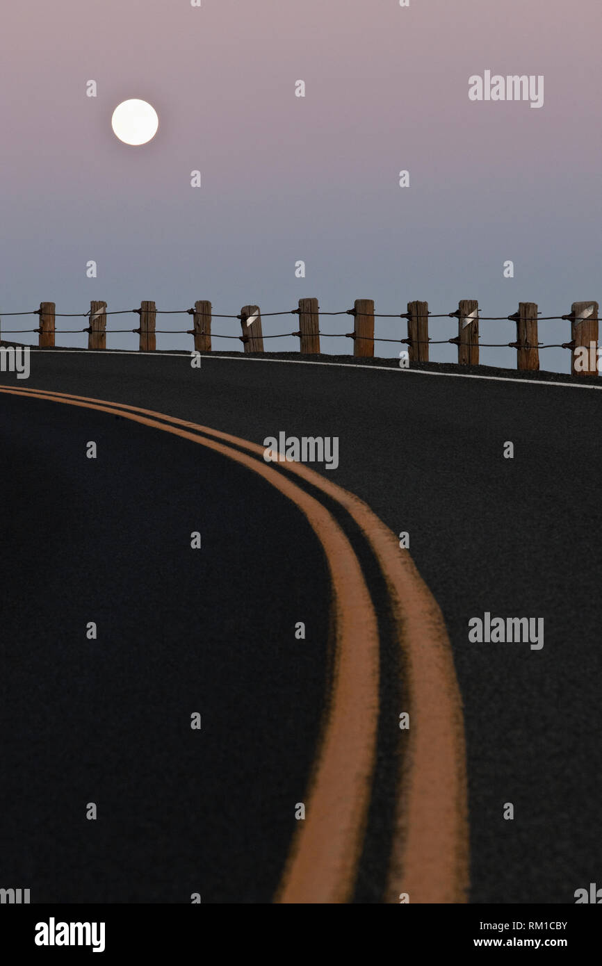 Full Moon Over a Curving Road Stock Photo - Alamy