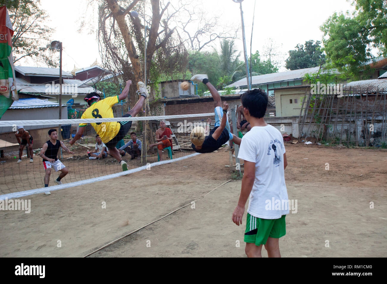 Boys in a cane ball play match, Nyaung-U village, Bagan village area ...
