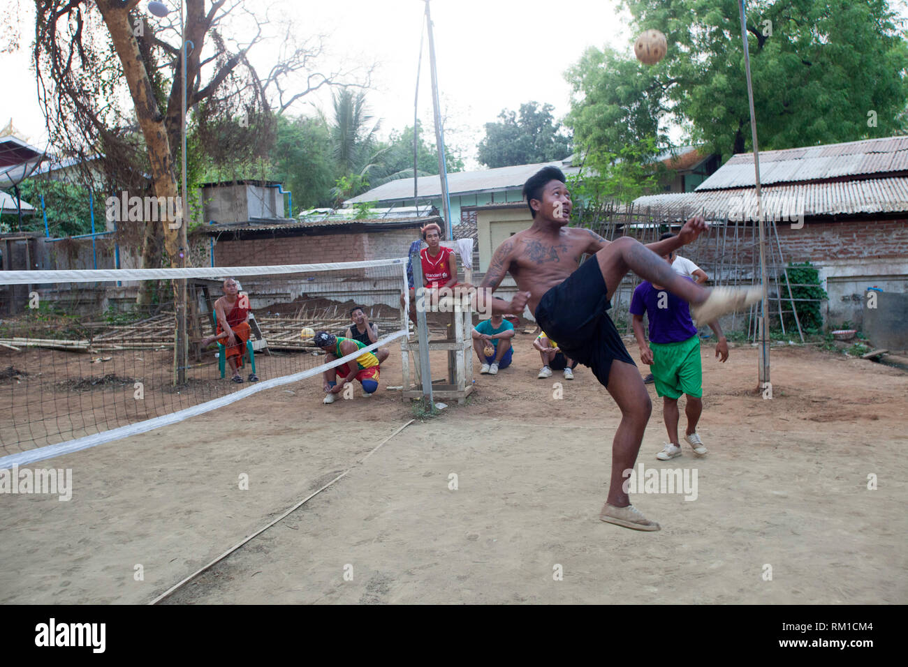 Boys in a cane ball play match, Nyaung-U village, Bagan village area ...