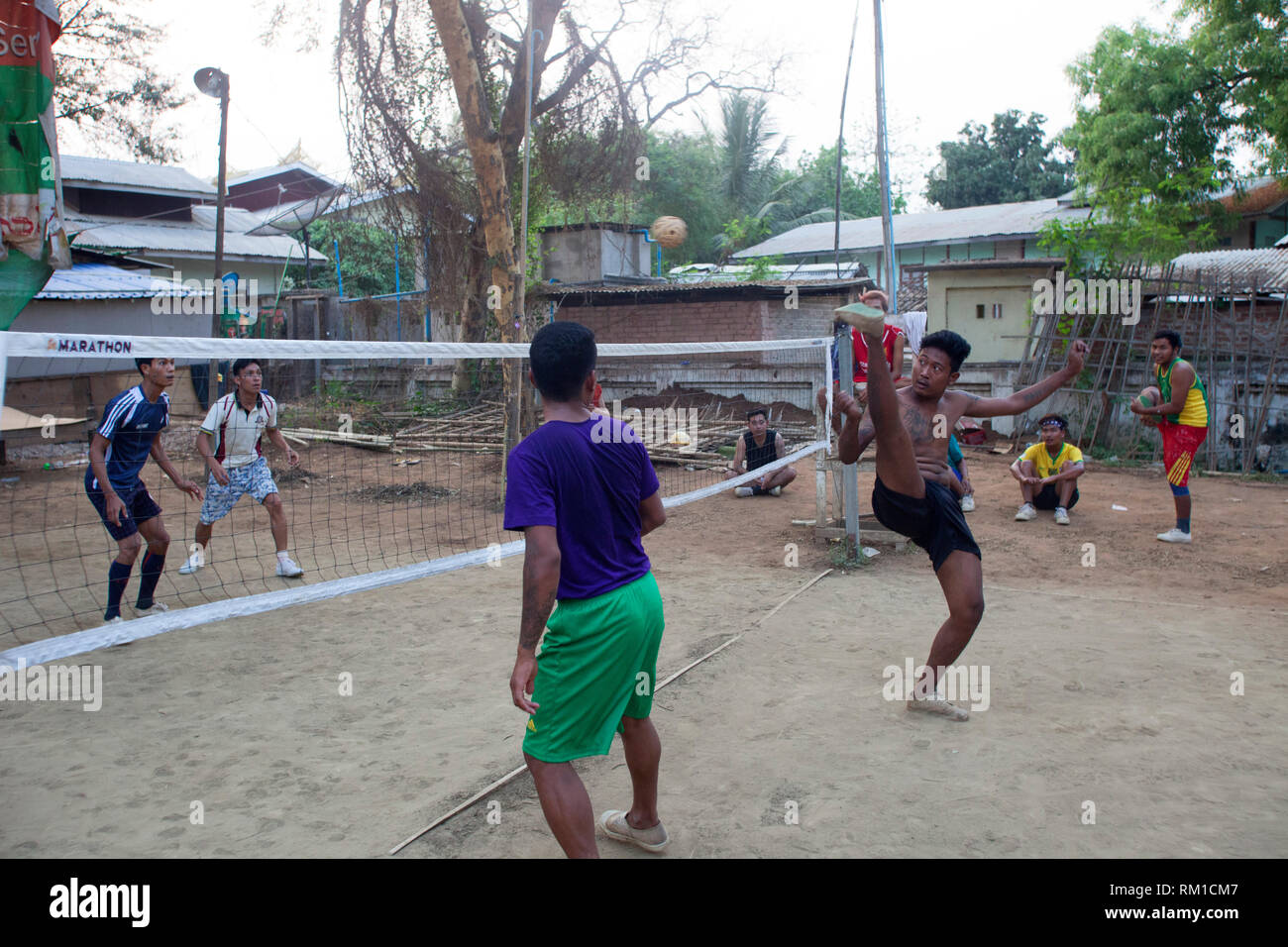 Boys in a cane ball play match, Nyaung-U village, Bagan village area ...