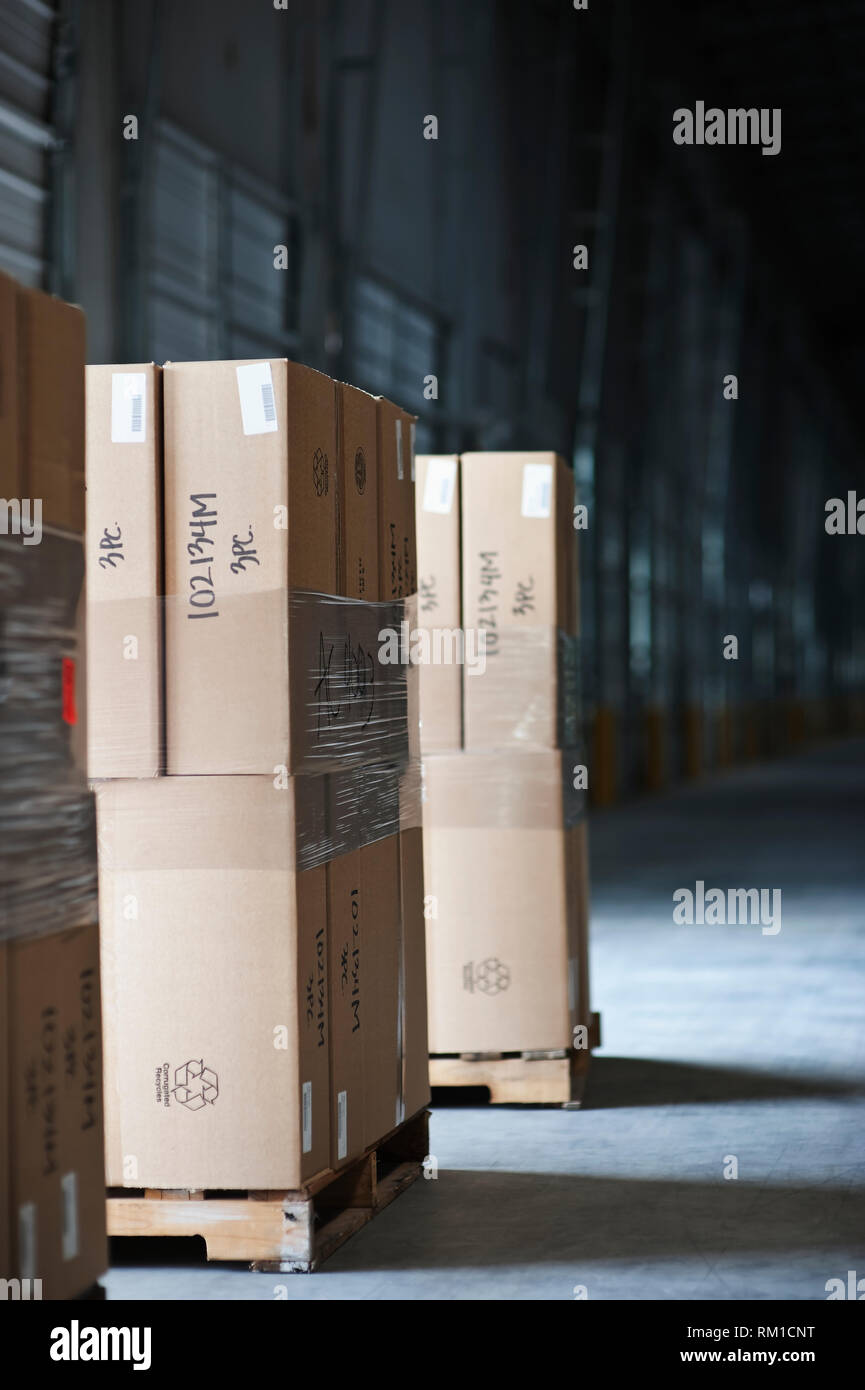 Pallets of Stacked Boxes Stock Photo - Alamy