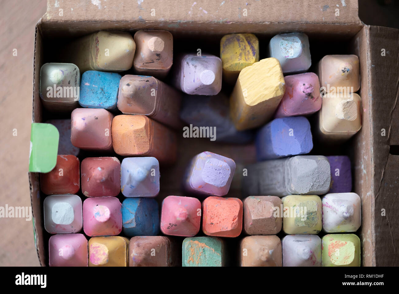 Box of colorful sidewalk chalk Stock Photo - Alamy