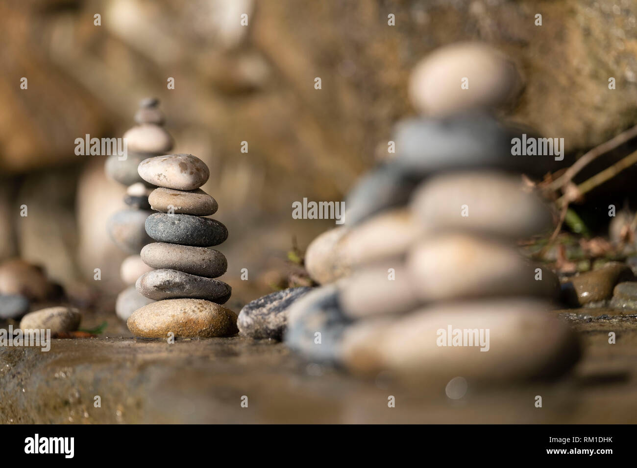 Spirit stones lined up at the beach Stock Photo - Alamy