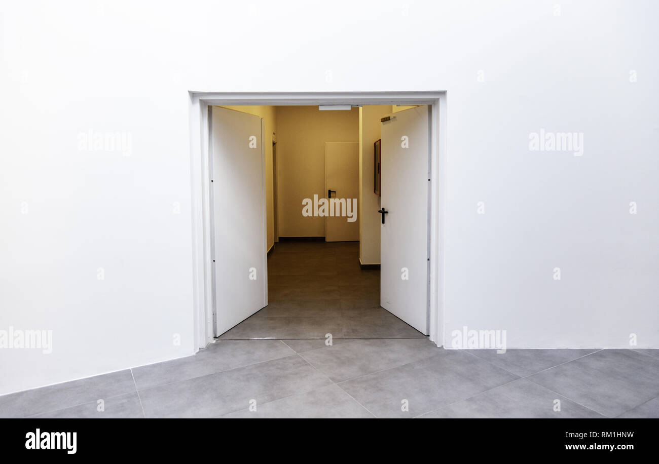 White door on a new white room, detail of the interior of a new ...