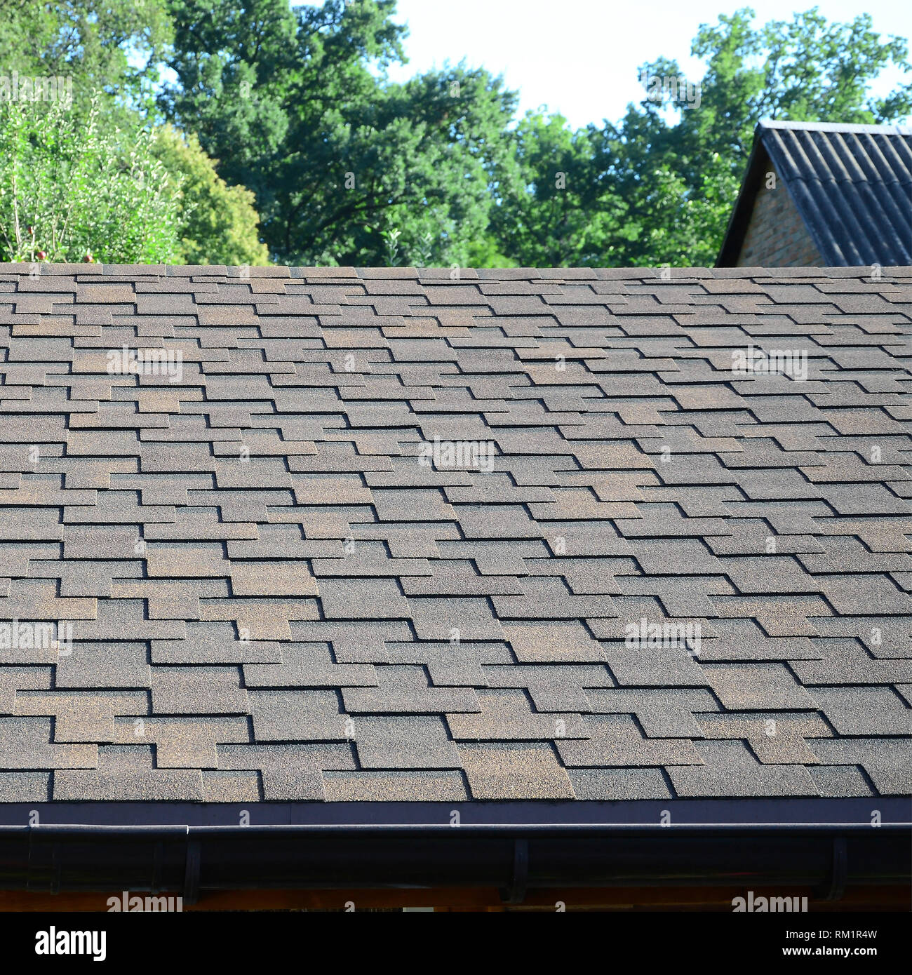 Modern roofing and decoration of chimneys. Flexible bitumen or slate ...