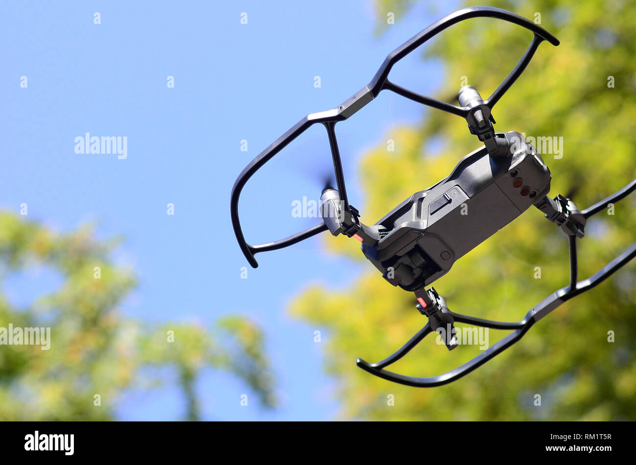 Drone with photocamera take off from land and flying for take aerial ...