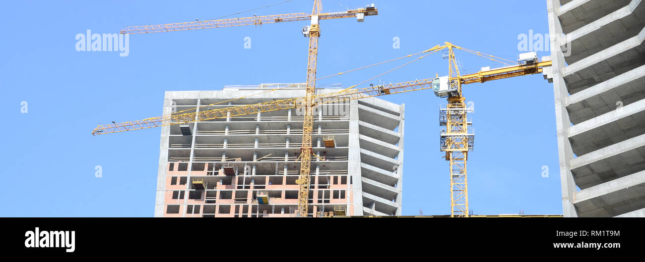 Construction site. High rise multi storey buildings under construction ...