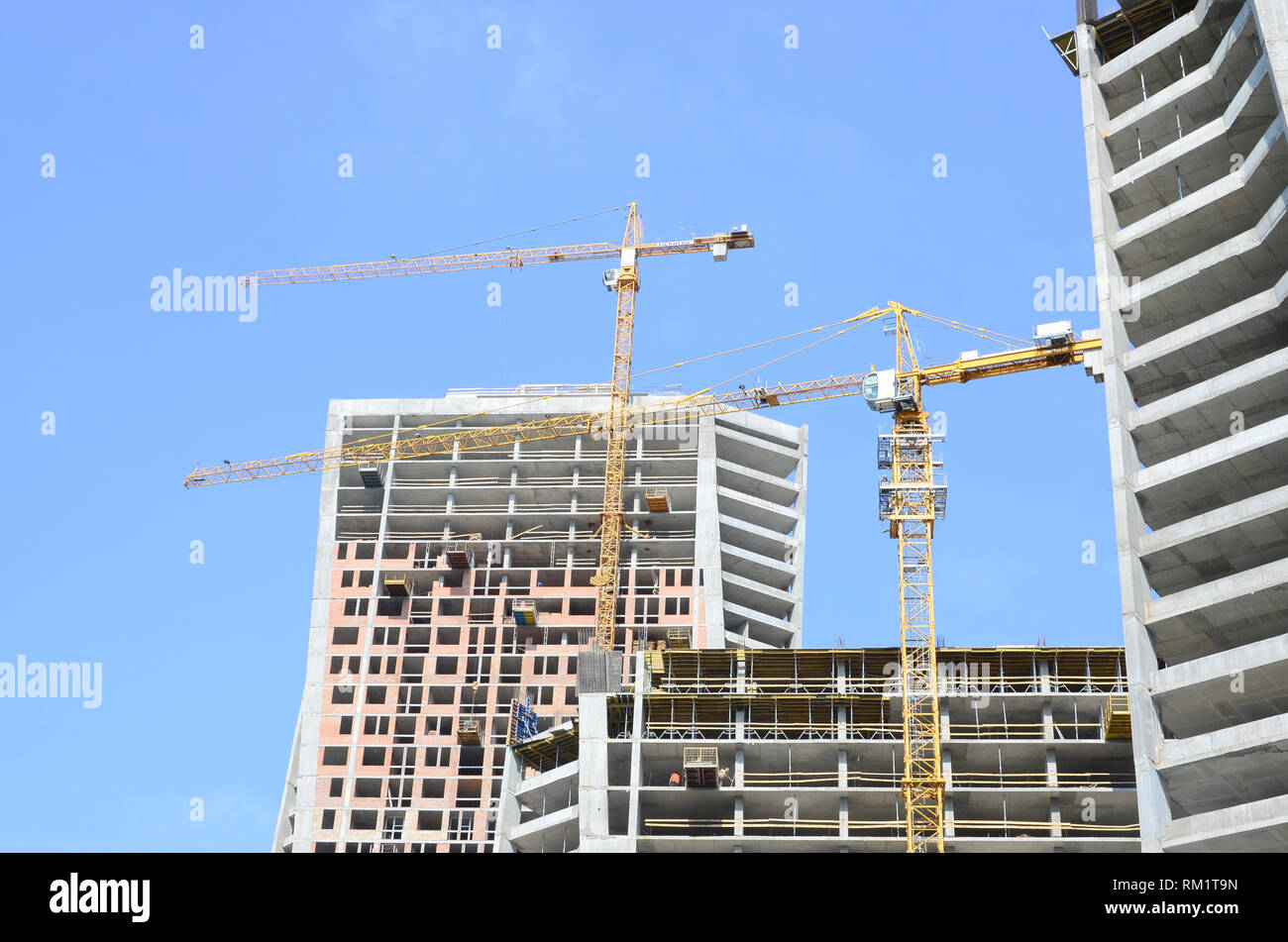 Construction site. High rise multi storey buildings under construction ...
