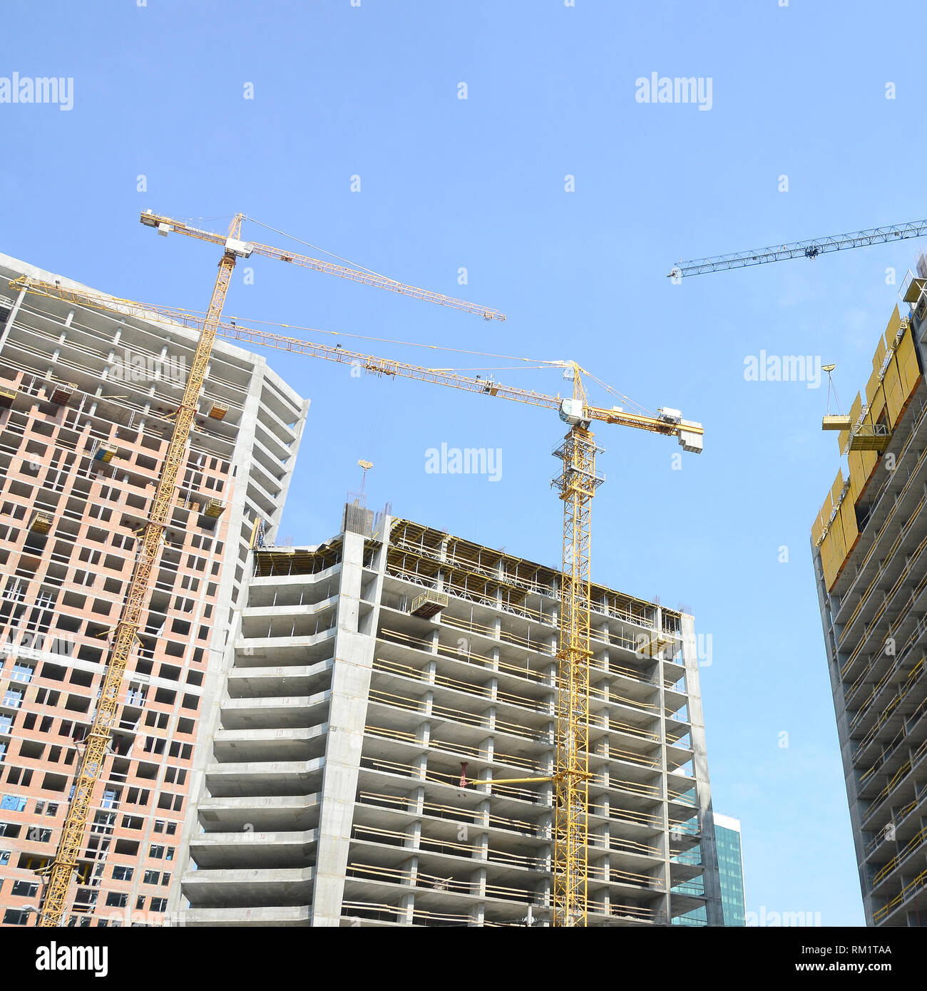 Construction site. High rise multi storey buildings under construction ...