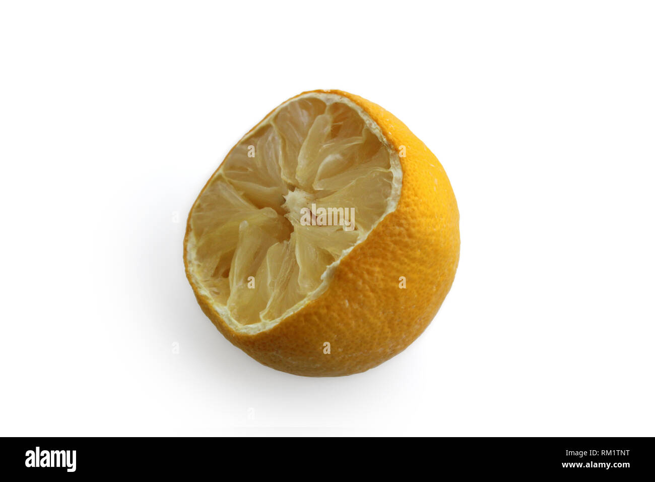 Half dried squeezed lemon, isolated on white background Stock Photo - Alamy