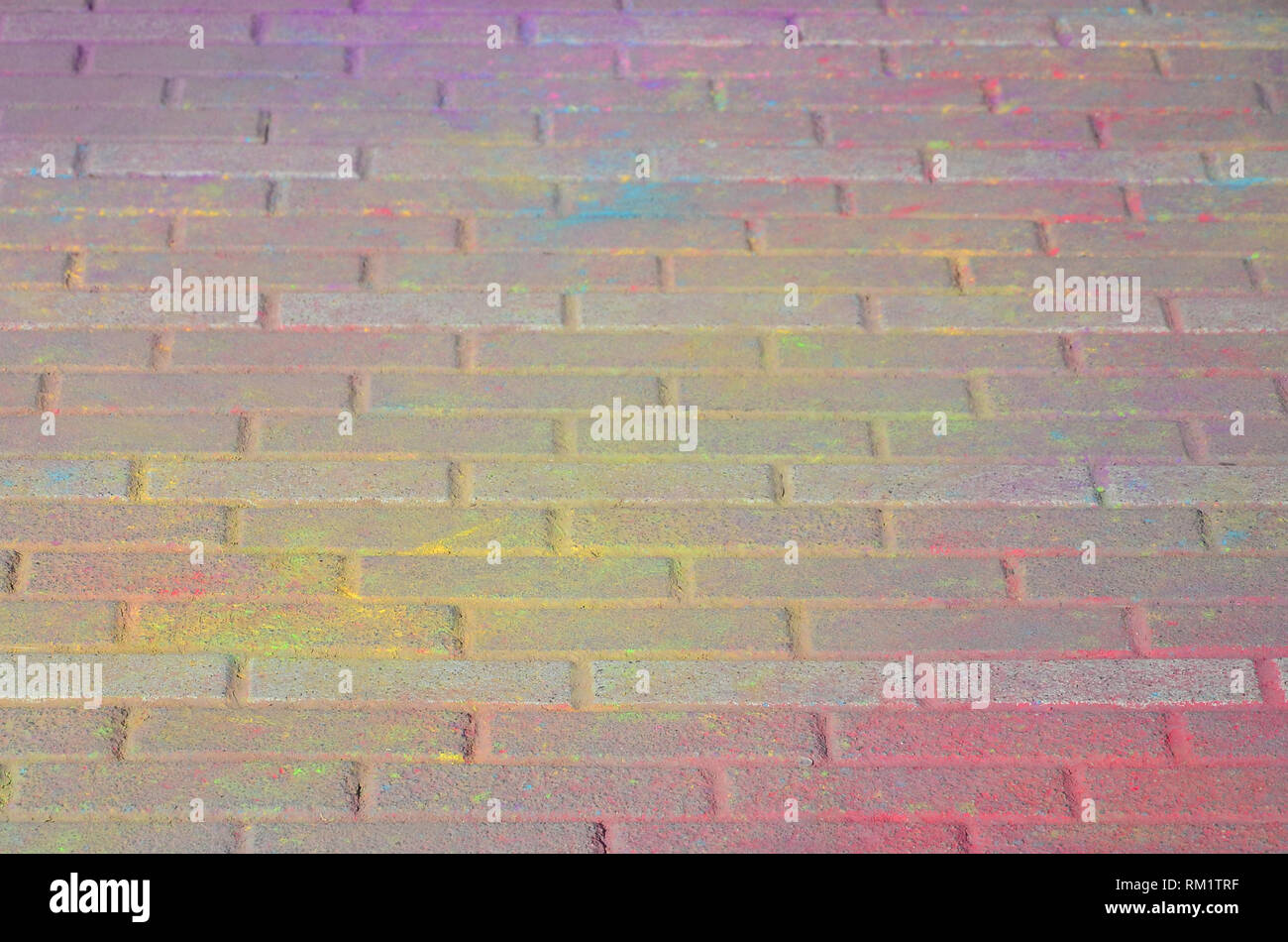 Multi colored earth, paving slabs, powder coated with dry colors at the ...