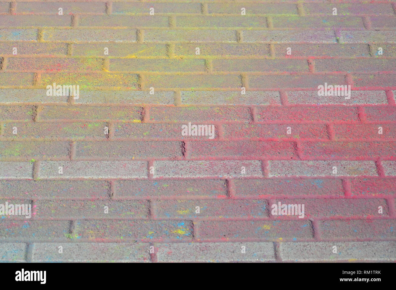 Multi colored earth, paving slabs, powder coated with dry colors at the ...