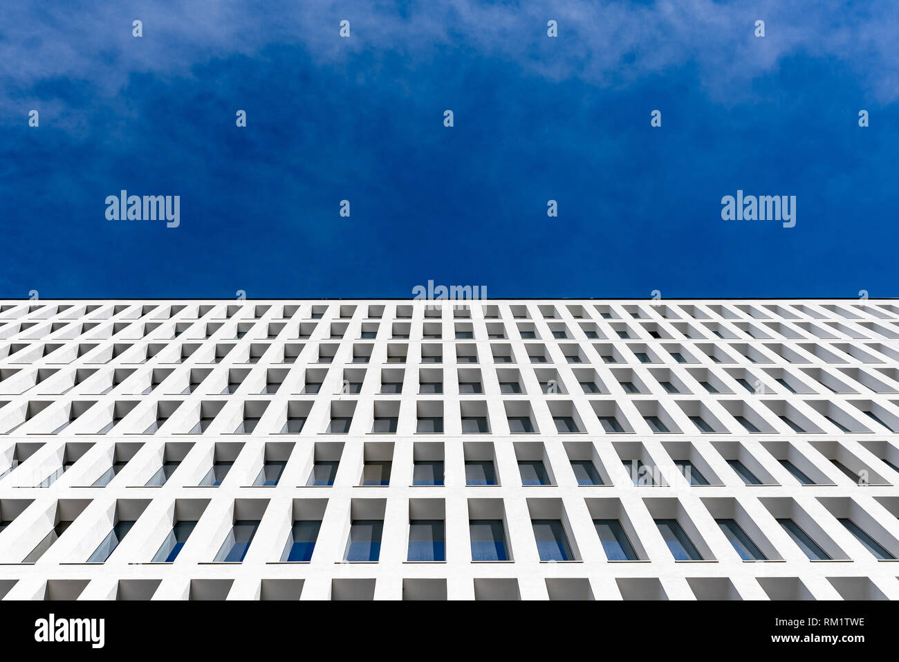 modern tertiary and businness building with white facade and windows ...
