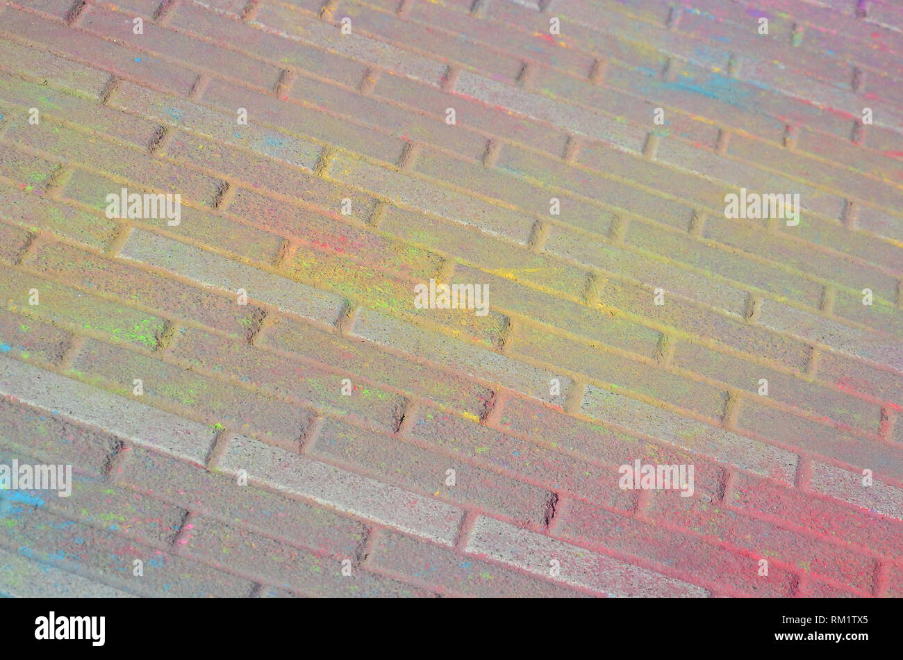 Multi colored earth, paving slabs, powder coated with dry colors at the ...