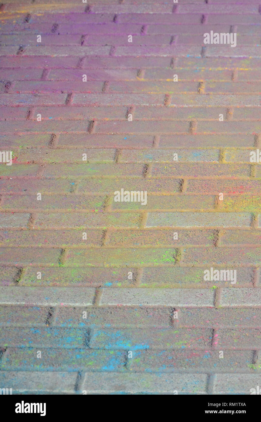 Multi colored earth, paving slabs, powder coated with dry colors at the ...