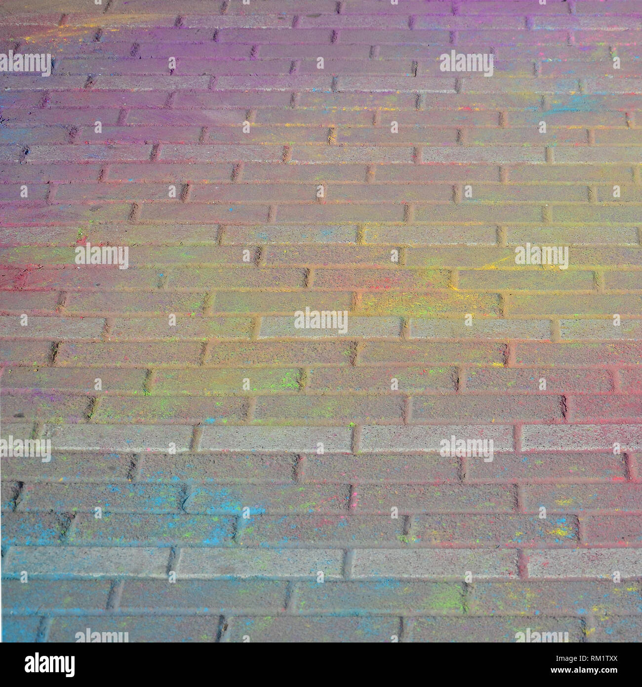 Multi colored earth, paving slabs, powder coated with dry colors at the ...