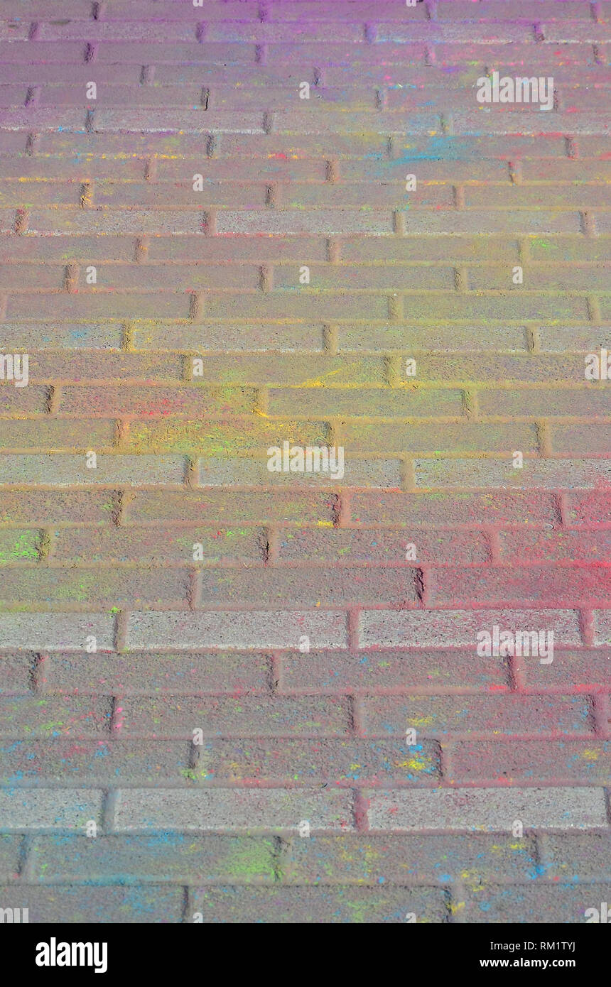 Multi colored earth, paving slabs, powder coated with dry colors at the ...