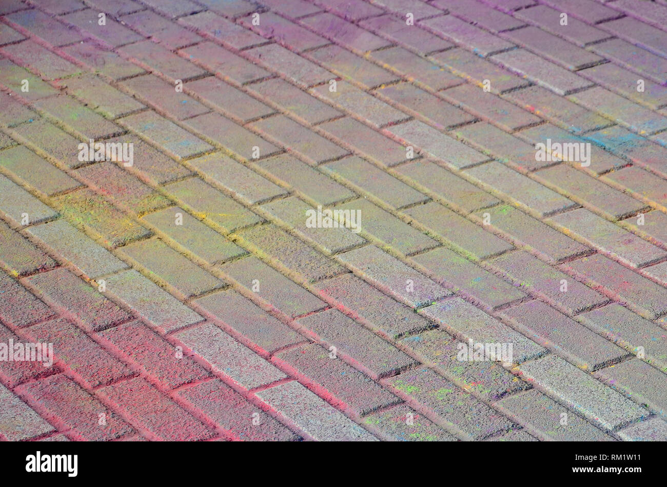 Multi colored earth, paving slabs, powder coated with dry colors at the ...