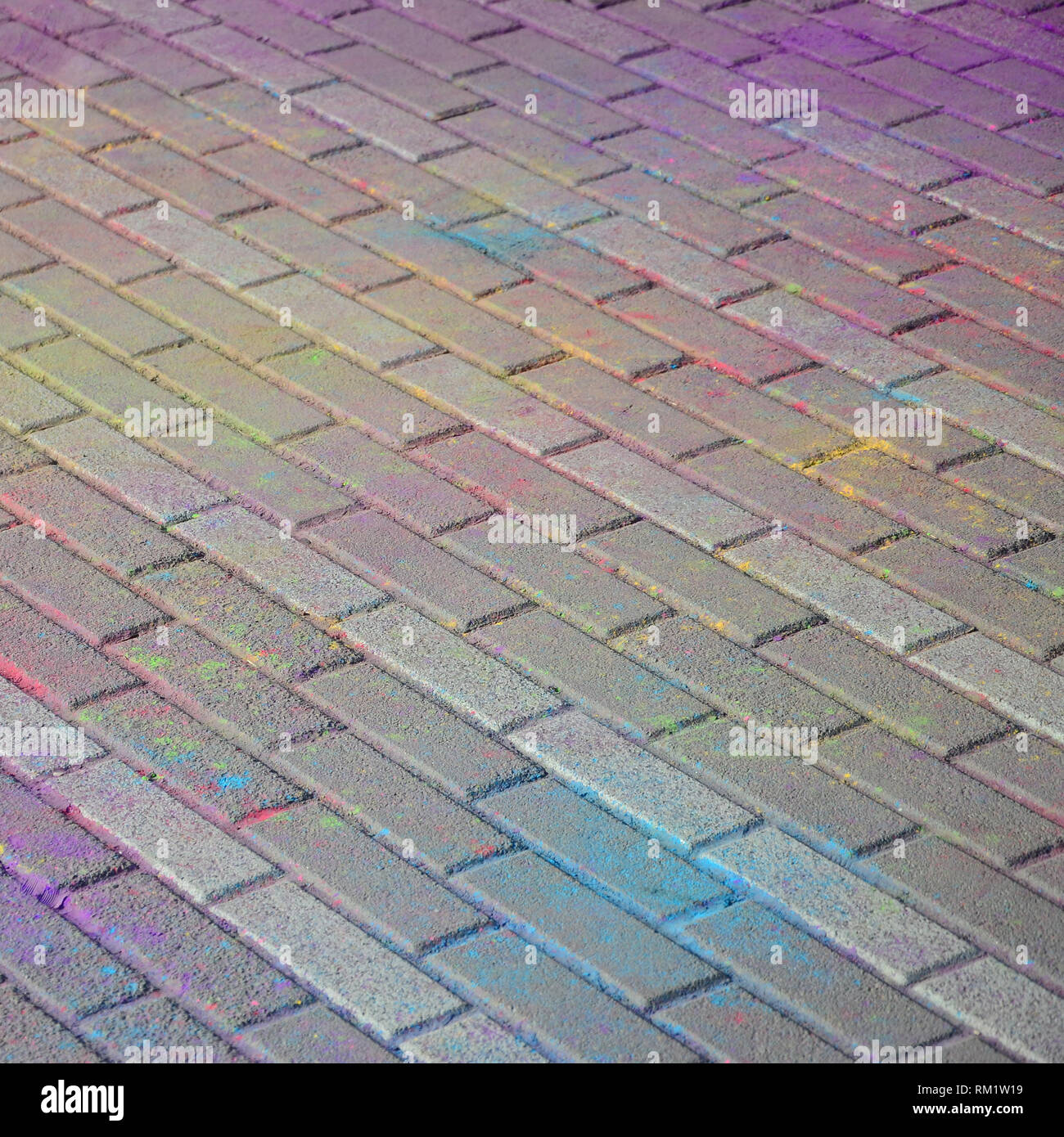 Multi colored earth, paving slabs, powder coated with dry colors at the ...