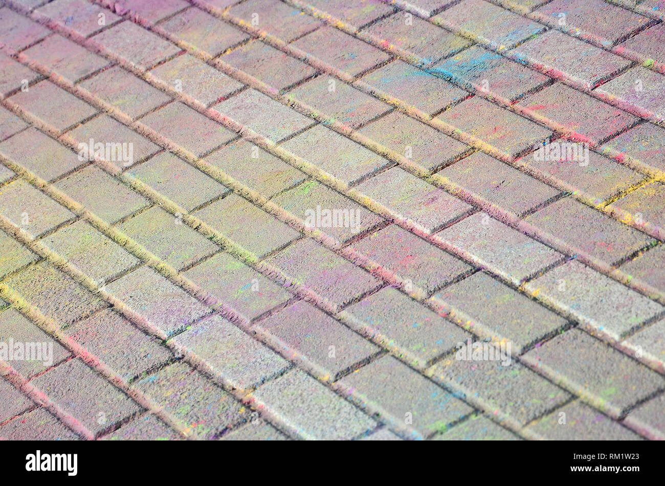 Multi colored earth, paving slabs, powder coated with dry colors at the ...