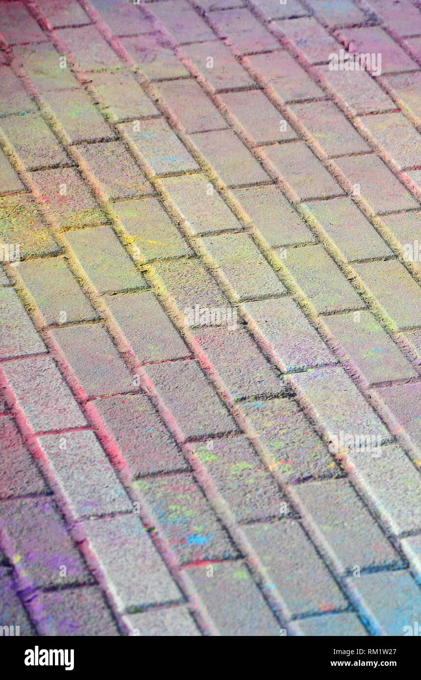 Multi colored earth, paving slabs, powder coated with dry colors at the ...