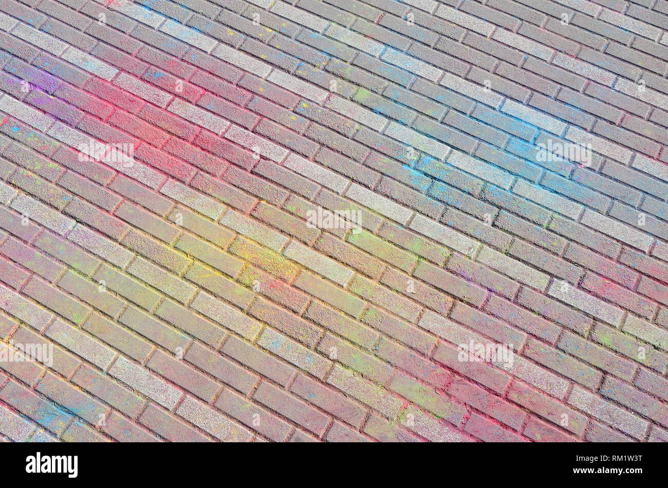 Multi colored earth, paving slabs, powder coated with dry colors at the ...