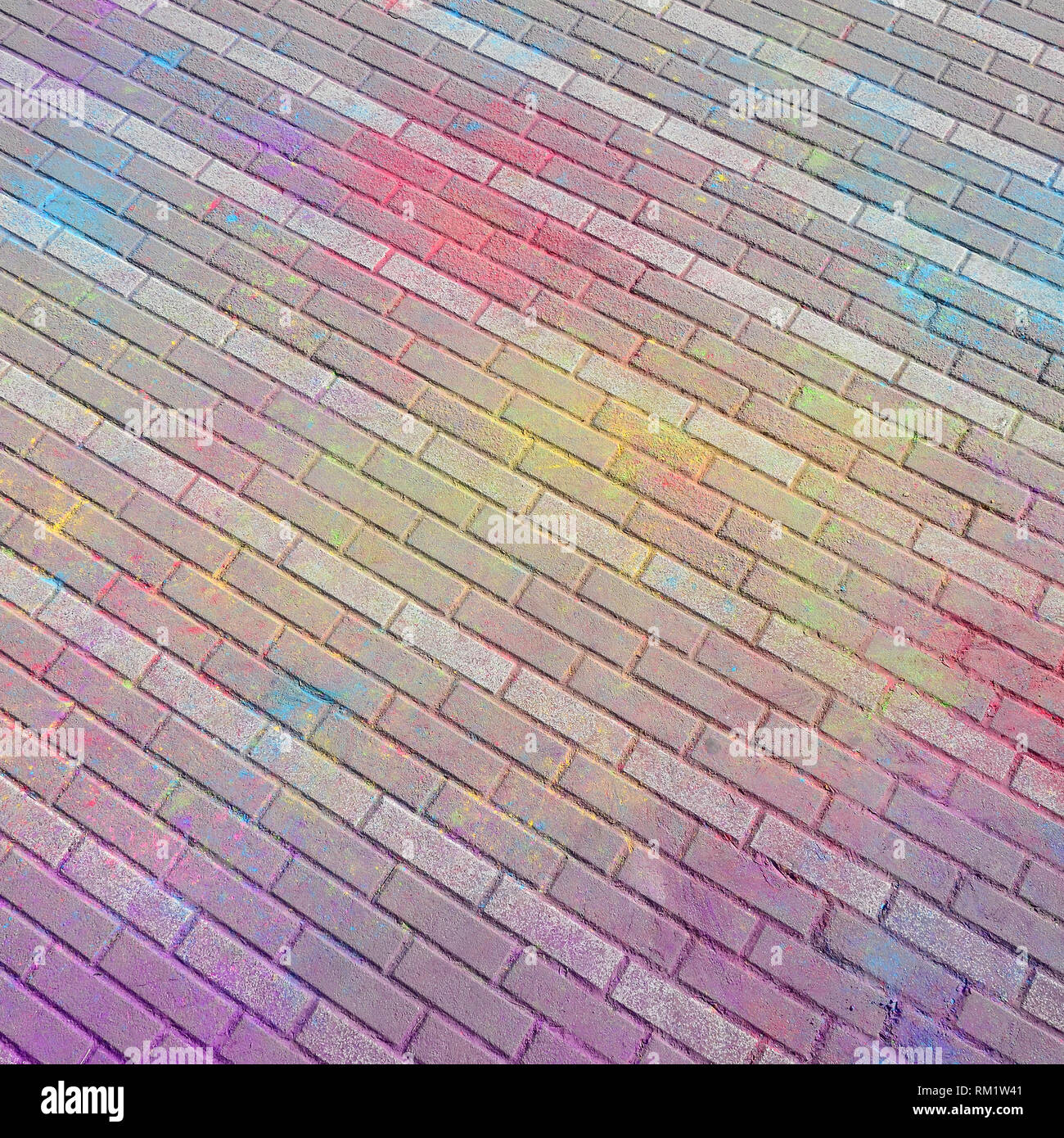 Multi colored earth, paving slabs, powder coated with dry colors at the ...