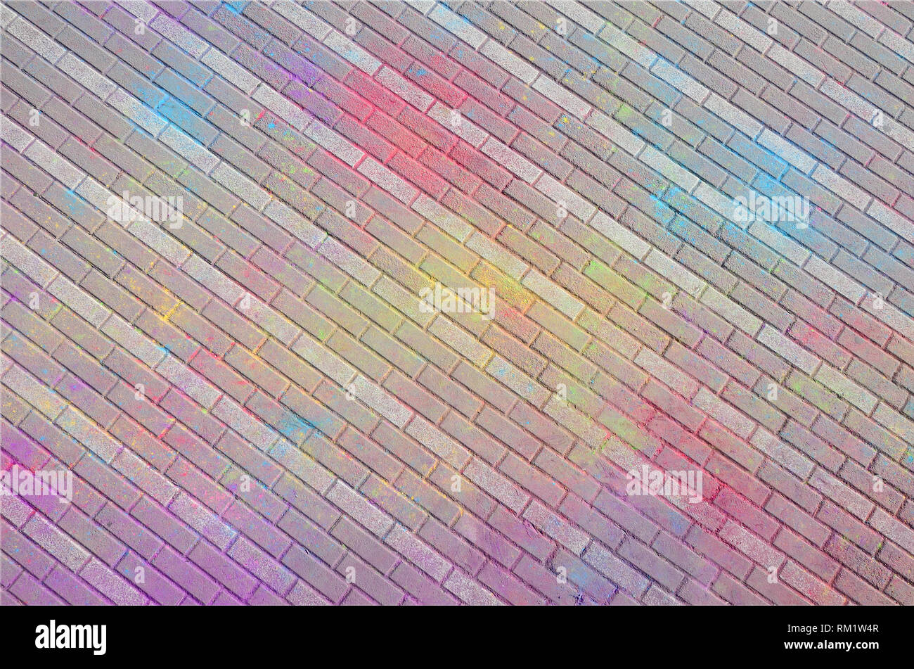 Multi colored earth, paving slabs, powder coated with dry colors at the ...