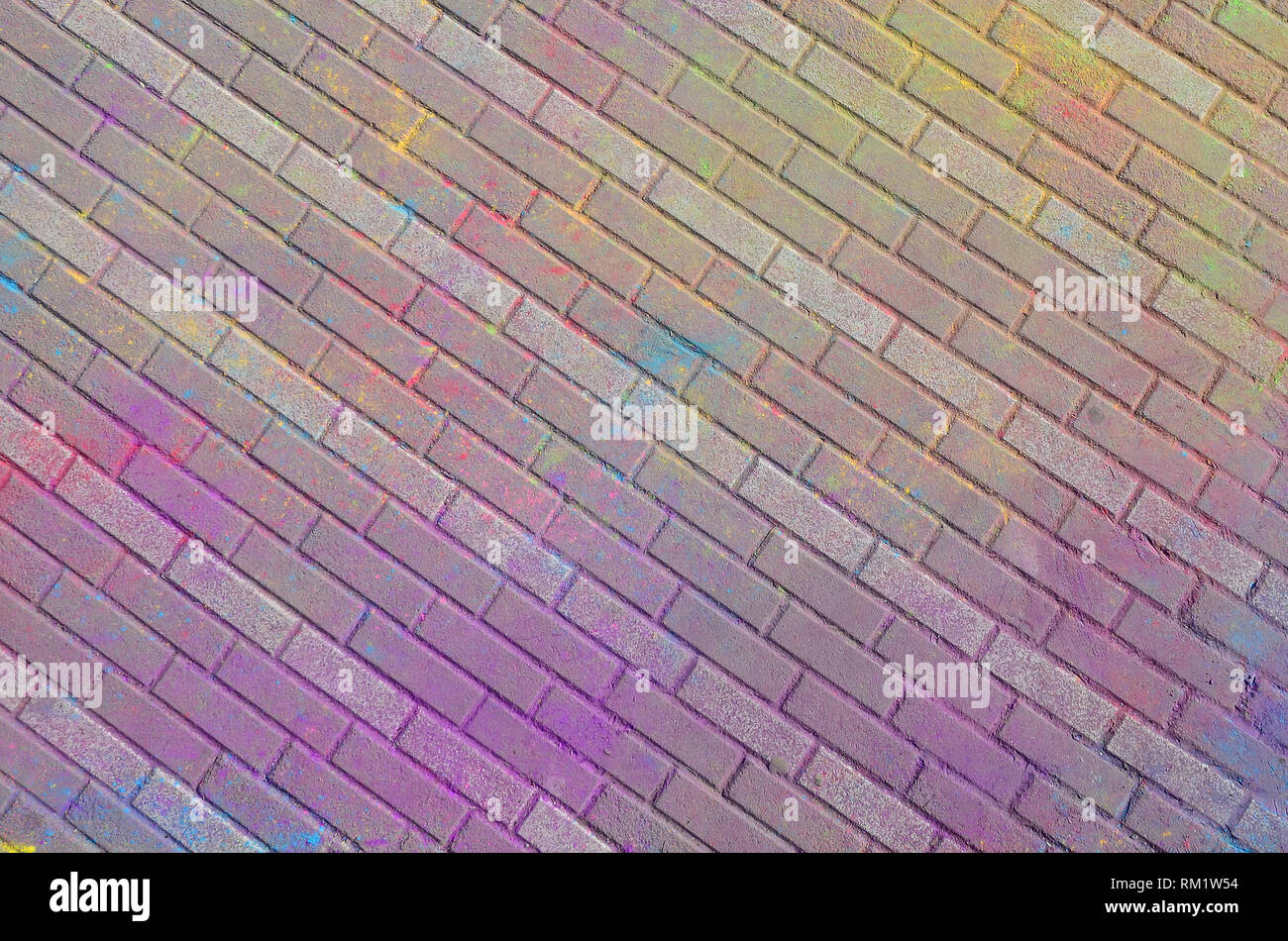 Multi colored earth, paving slabs, powder coated with dry colors at the ...