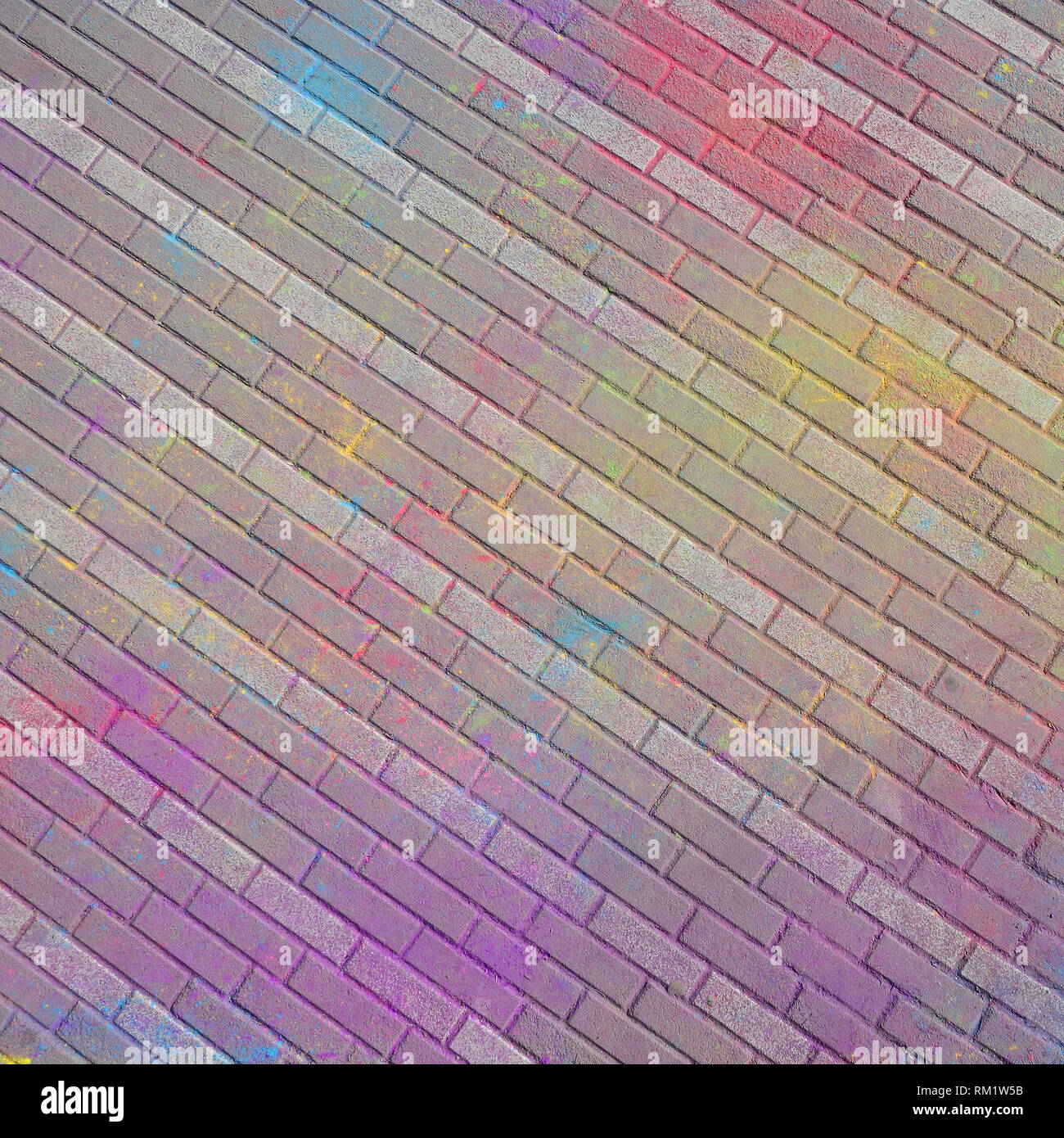 Multi colored earth, paving slabs, powder coated with dry colors at the ...