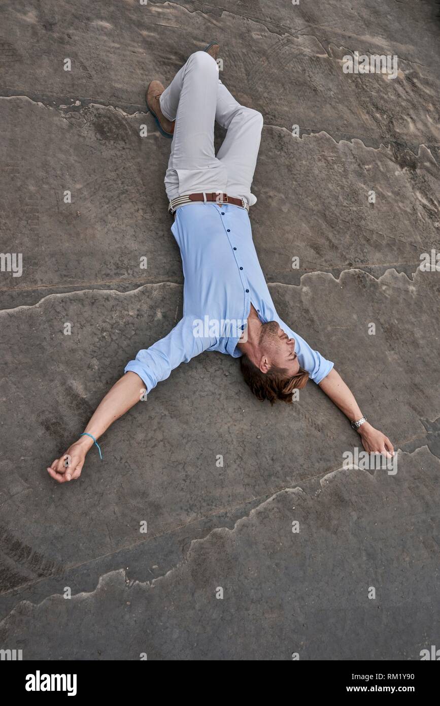 Street man lying on floor hi-res stock photography and images - Alamy